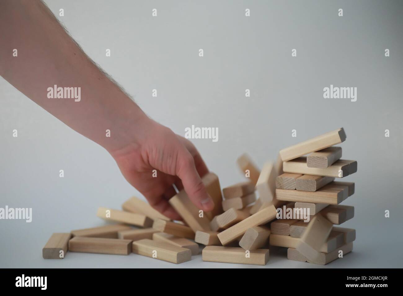 Board game jenga tower of light wood sticks Stock Photo - Alamy