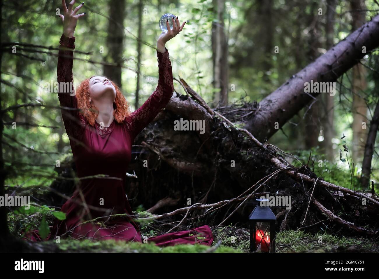 Witch holds a ritual in the depths of the forest Stock Photo - Alamy