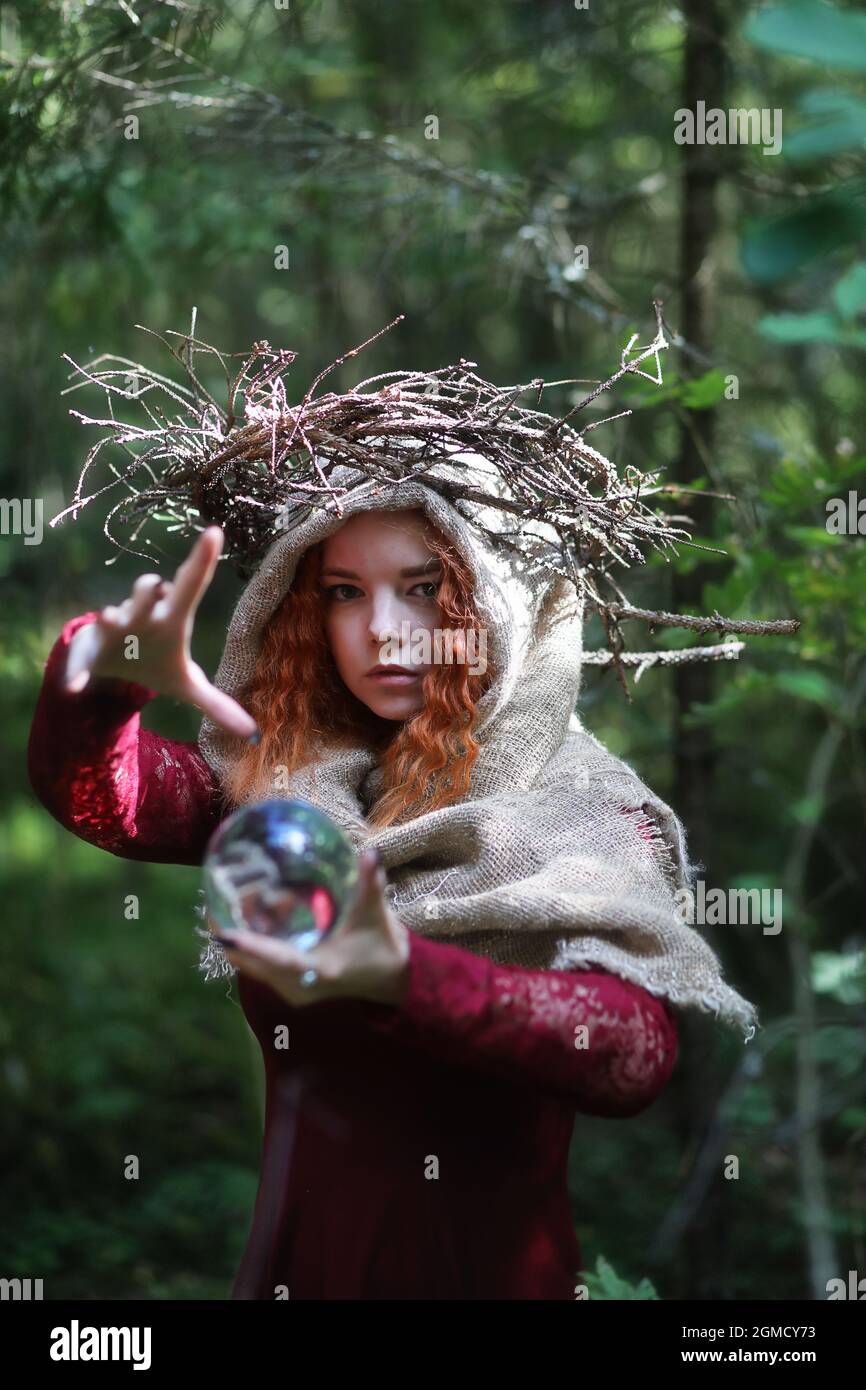 Fortune-teller conducts a ritual in the depths of the forest Stock ...