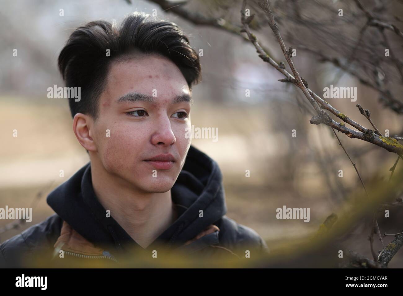Asian boy teenager in nature season cold weather Stock Photo - Alamy