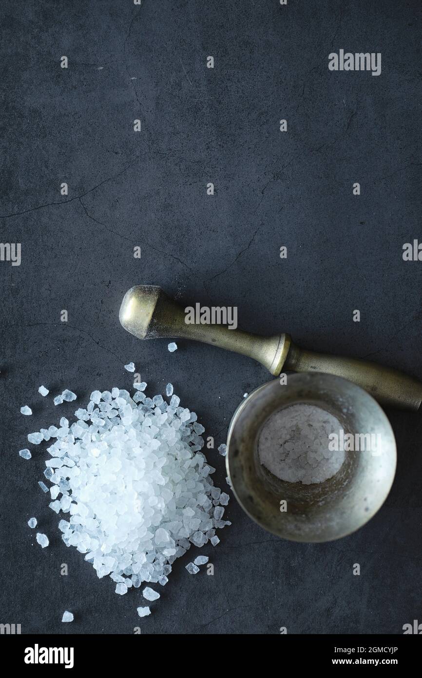 Large sea salt. Spice. Mortar and pestle for grinding salt Stock Photo ...
