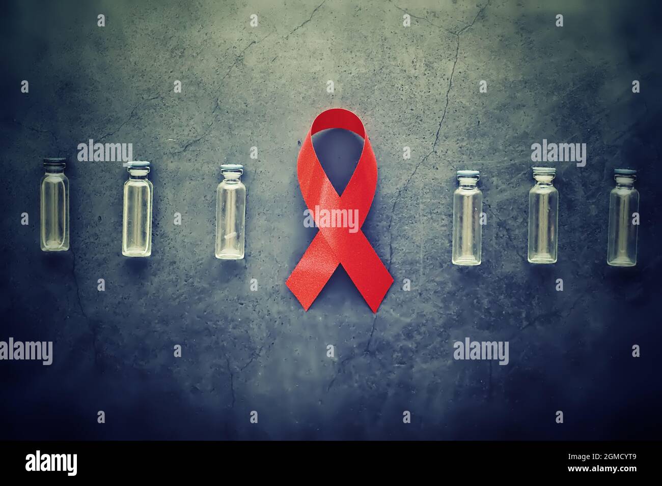Symbol of human immunodeficiency virus disease. Red ribbon. A helping ...