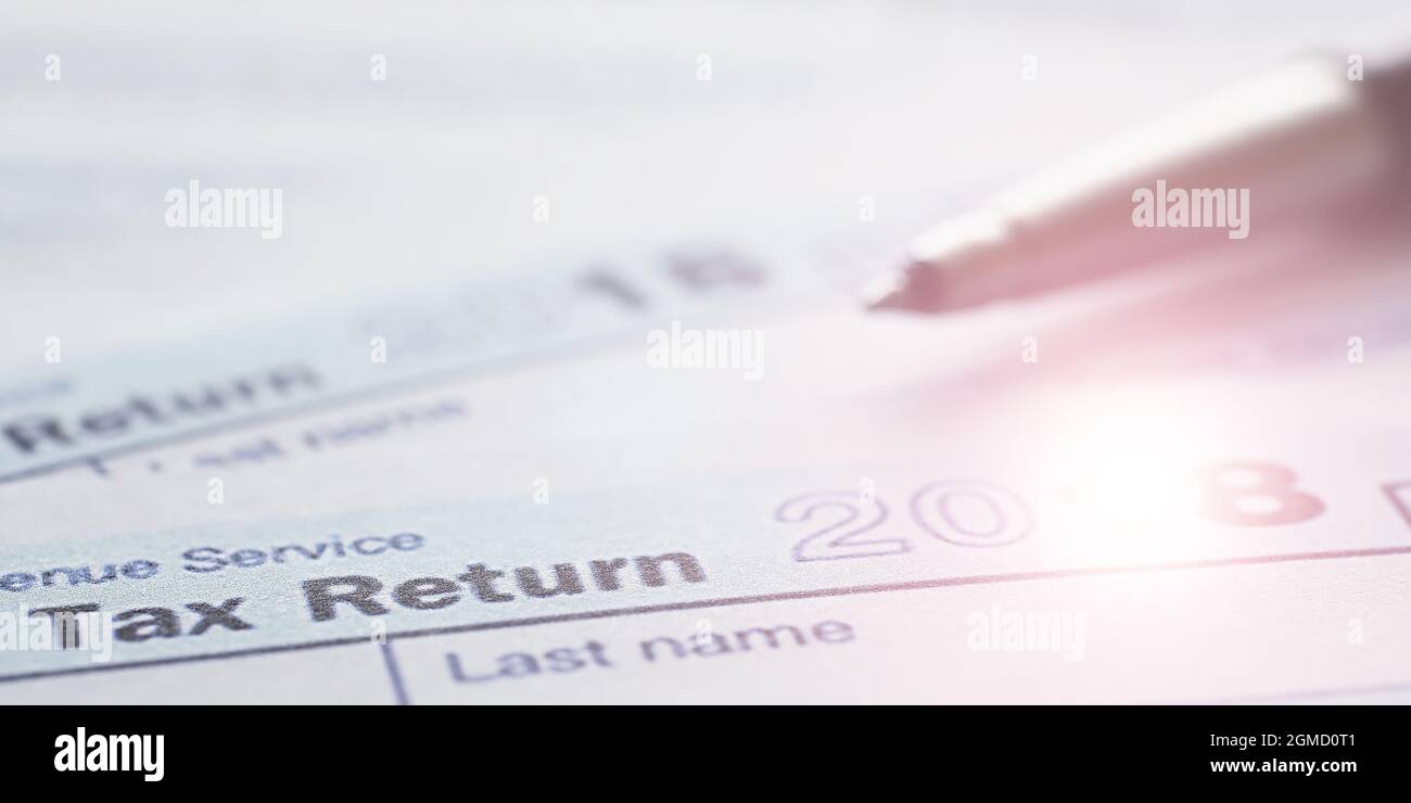 Annual tax reporting. Tax form on the table. Financial statements ...