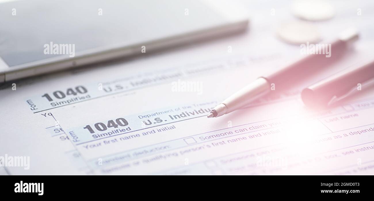 Annual tax reporting. Tax form on the table. Financial statements ...