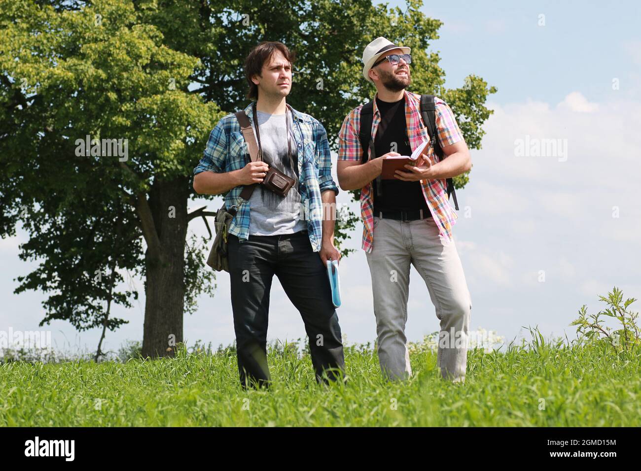 A young man looks at a map in the nature so as not to get lost Stock ...
