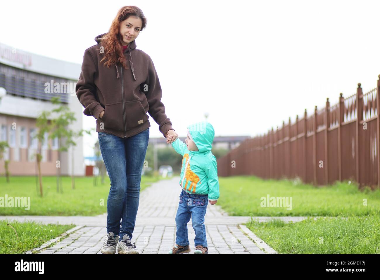 A small child on a walk with mother Stock Photo - Alamy