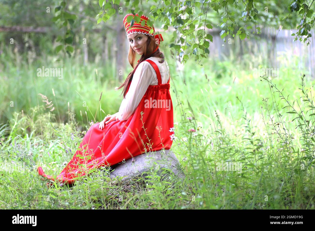 Slav in traditional dress is sitting in nature Stock Photo - Alamy
