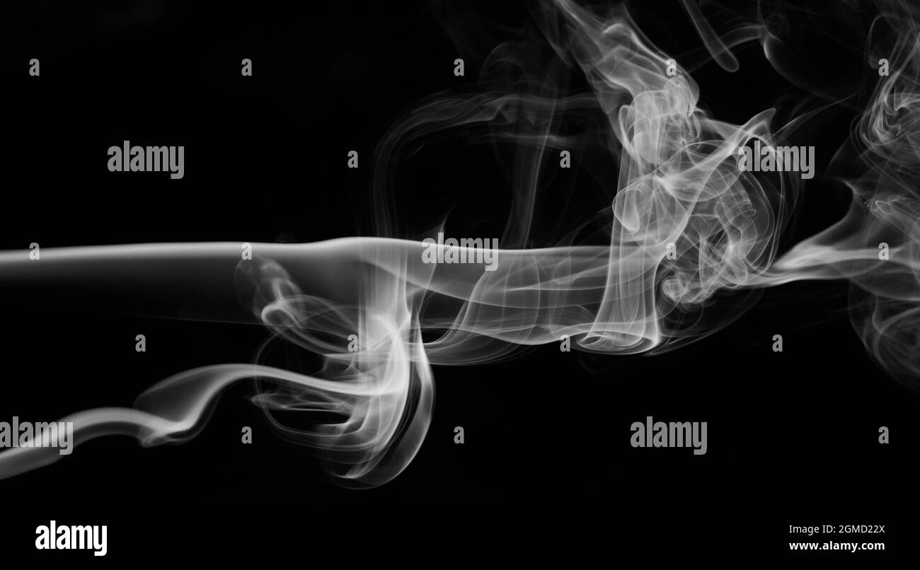 Straight line of smoke with swirl grey color on black studio background ...