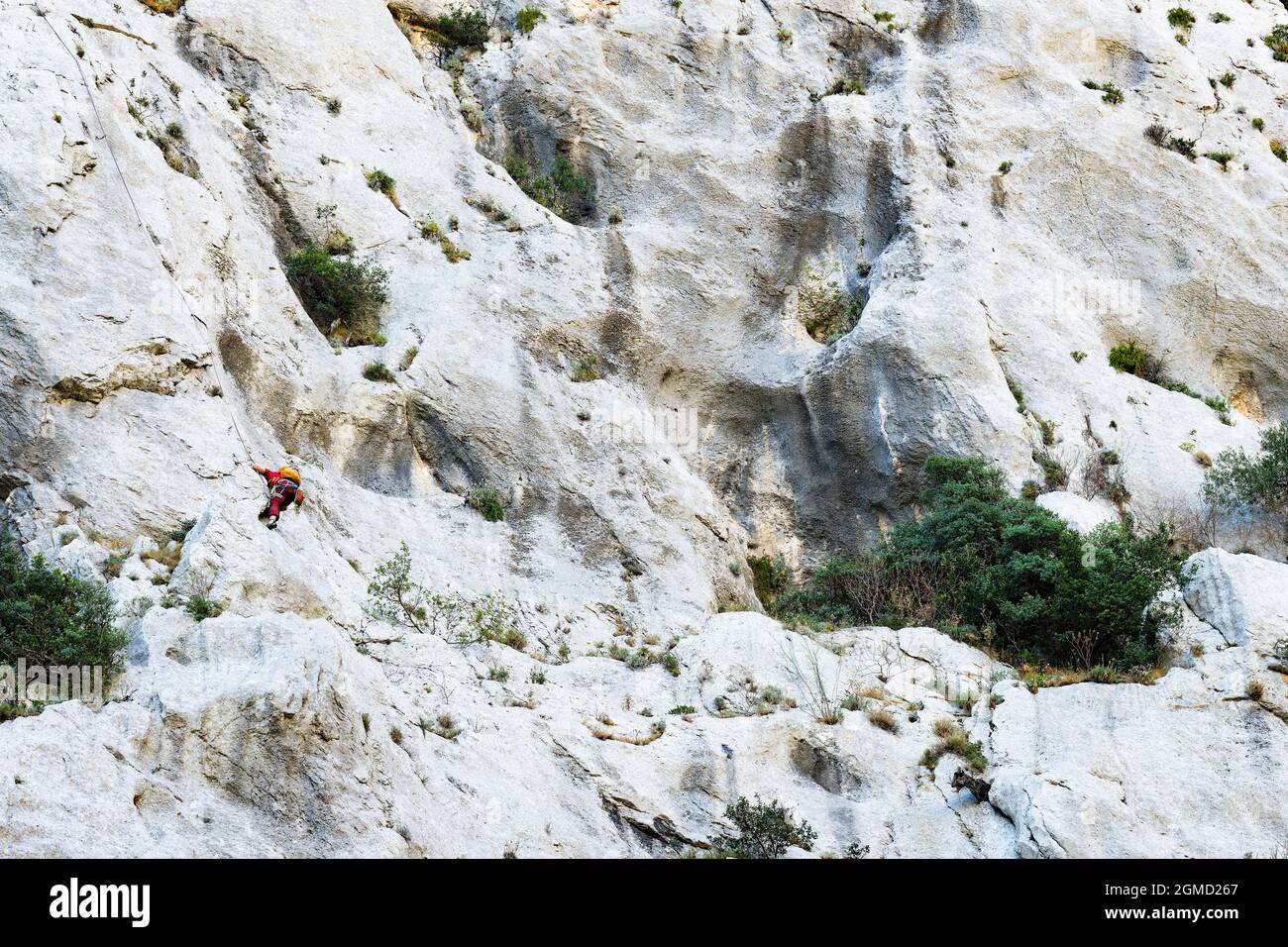 Stunning view of a person climbing the Gorropu gorge Stock Photo - Alamy