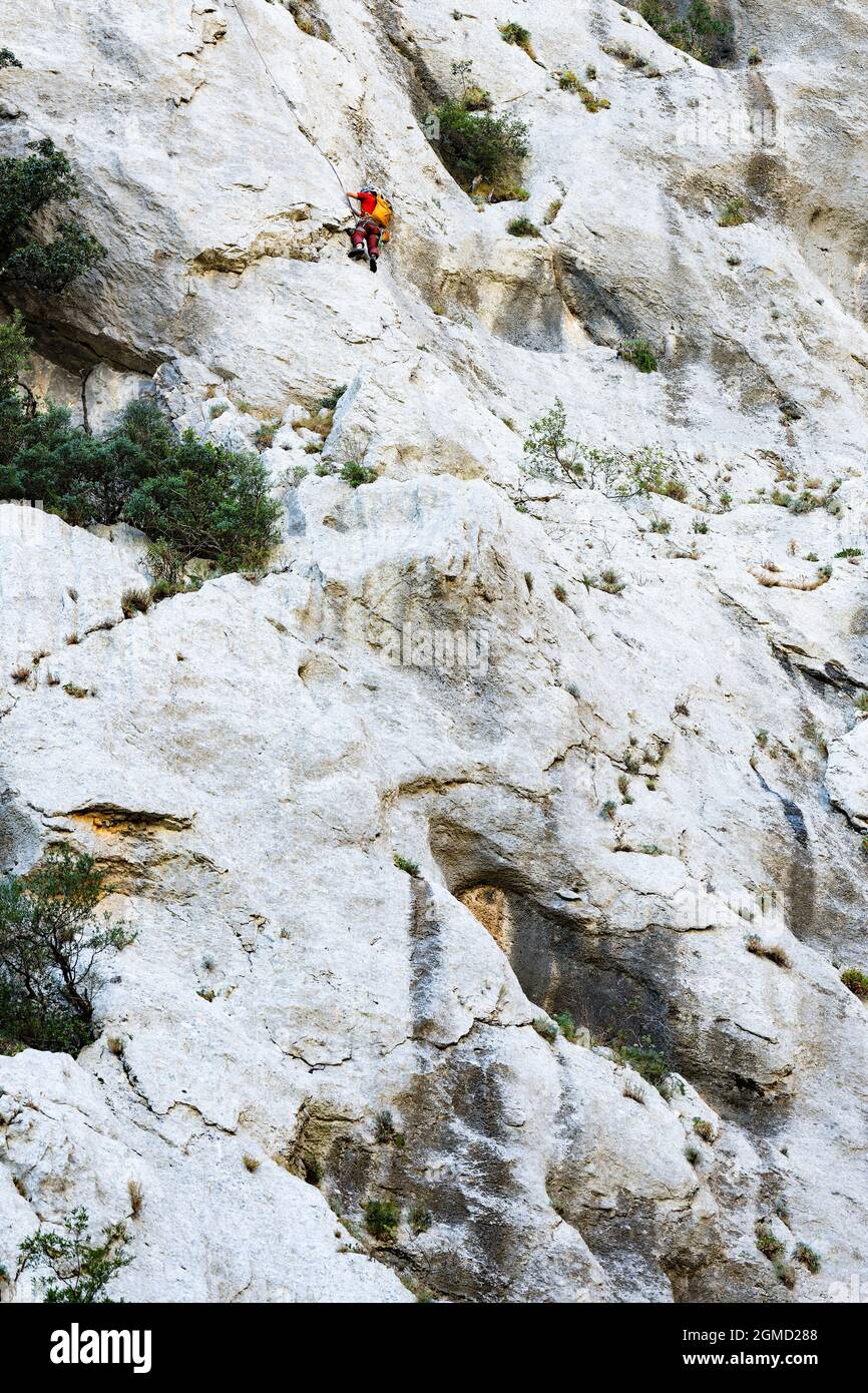 Stunning view of a person climbing the Gorropu gorge Stock Photo - Alamy