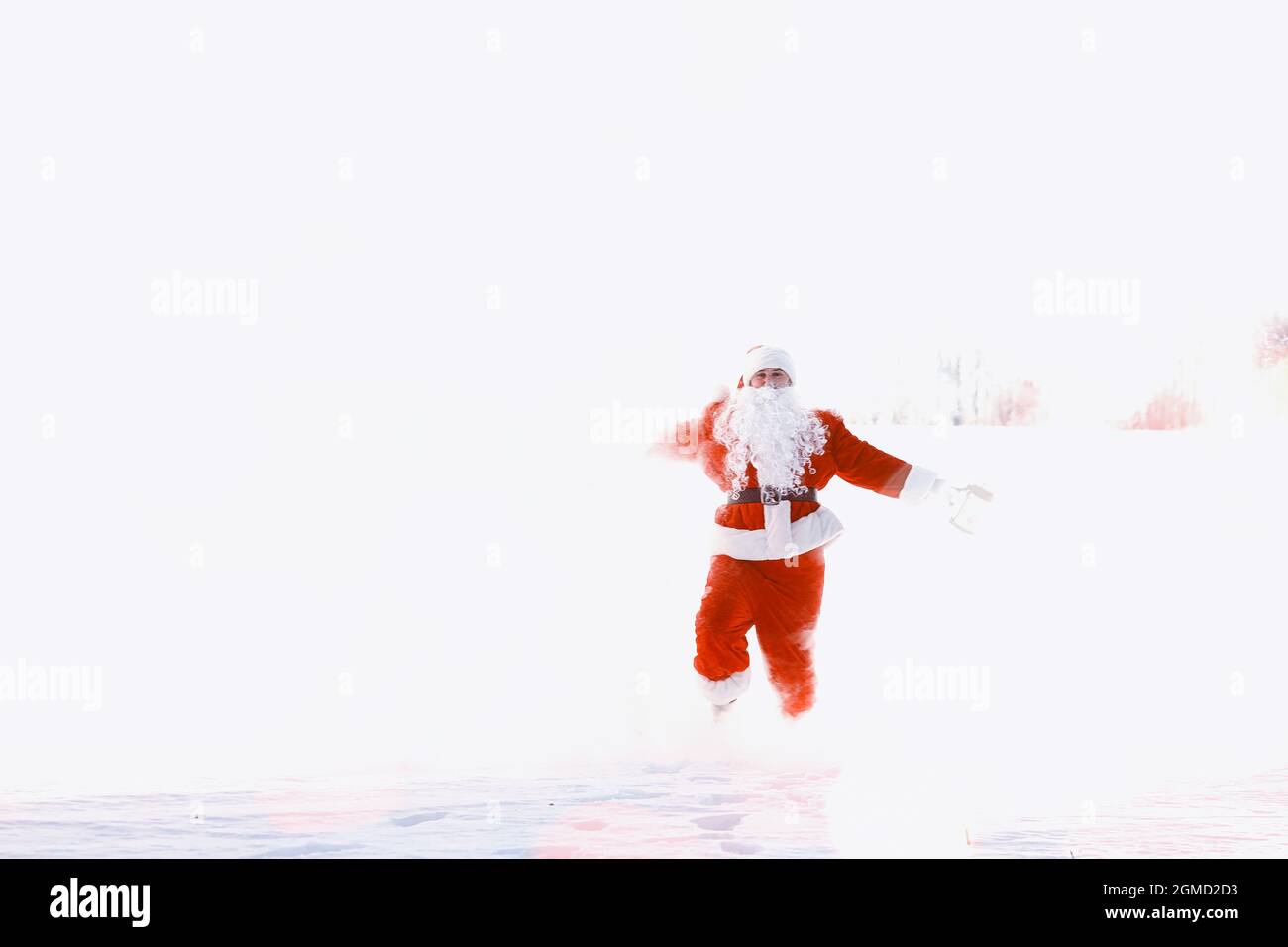 Santa in the winter field. Santa magical fog walking along the field ...