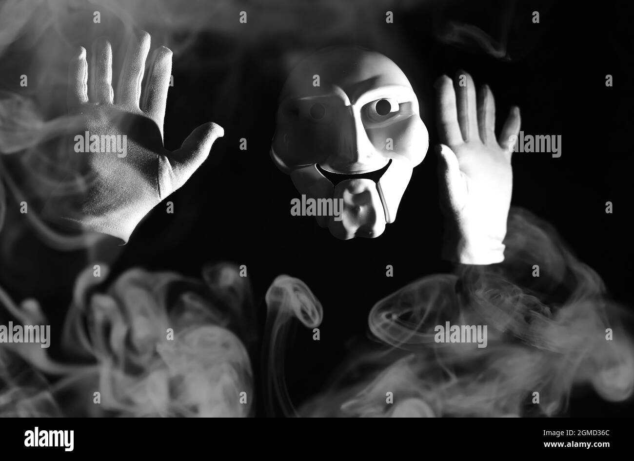White scary mask on a black background with whites hands Stock Photo ...