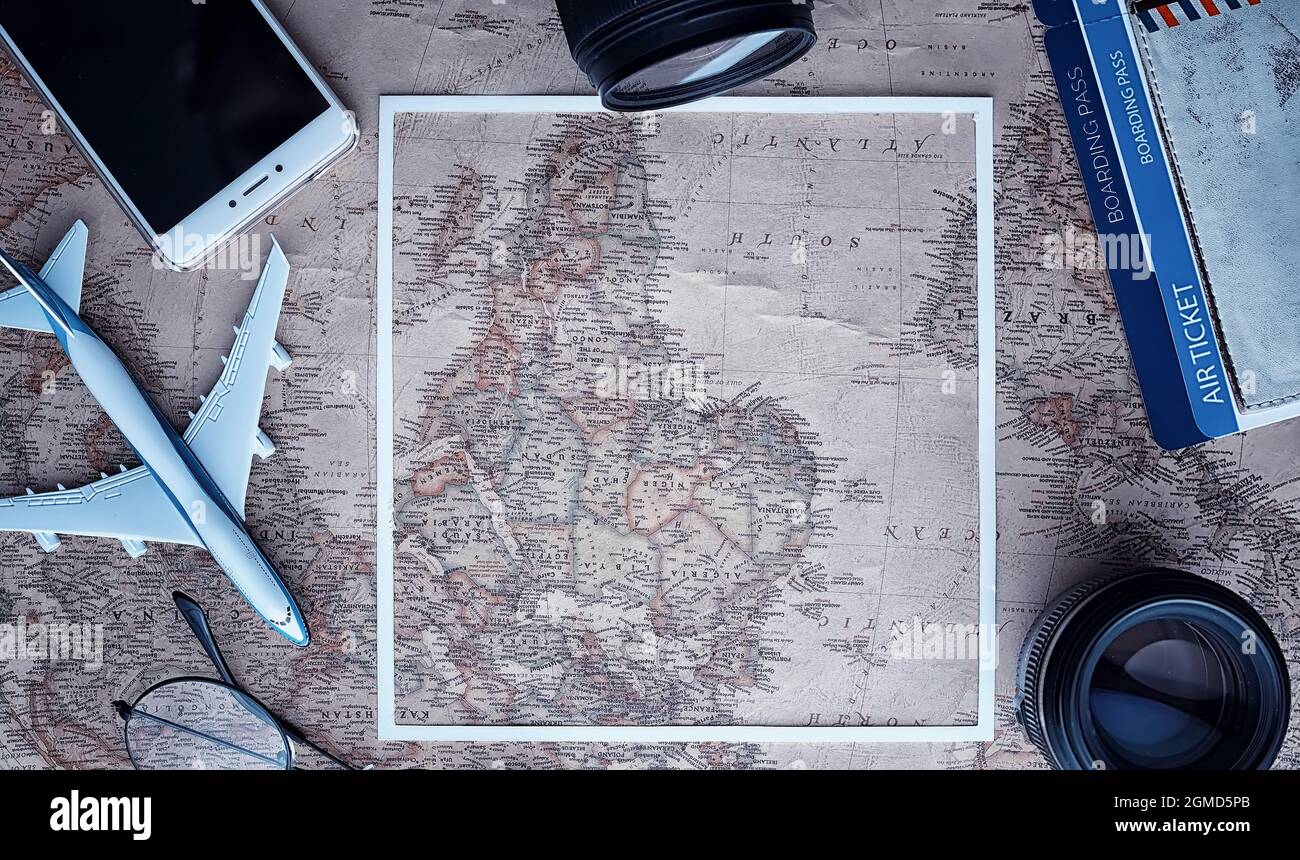 Travel concept. Map on the table and model aircraft Stock Photo - Alamy