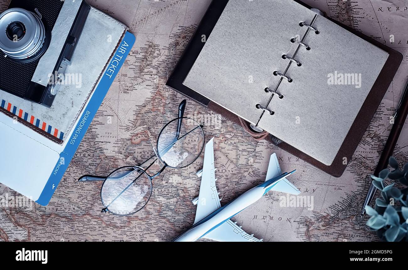 Travel concept. Map on the table and model aircraft Stock Photo - Alamy