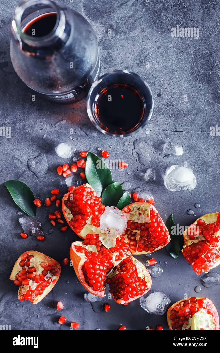 Ripe red pomegranate. Ripe grains of pomegranate on the table ...