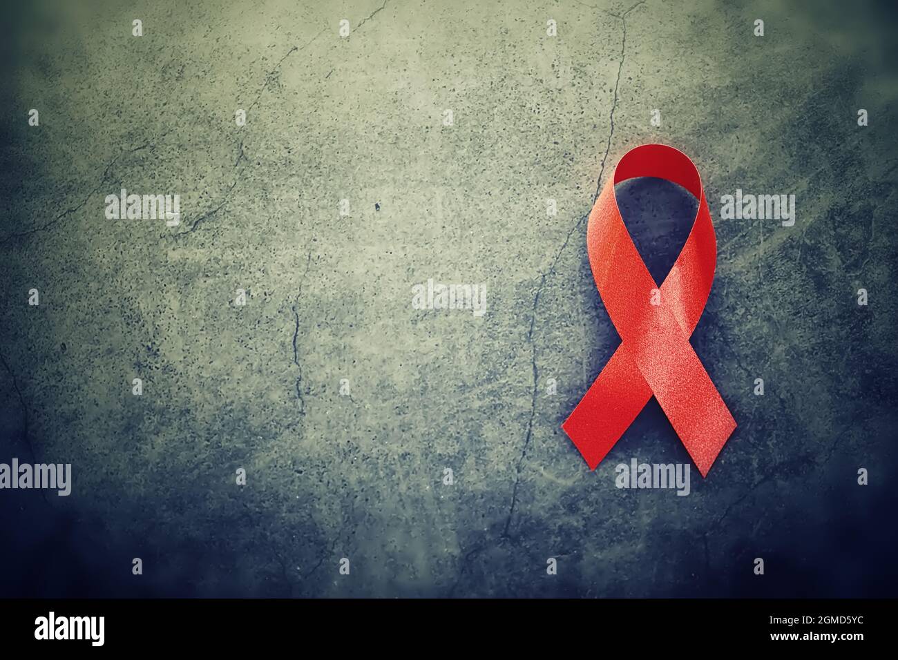 Symbol of human immunodeficiency virus disease. Red ribbon. A helping ...