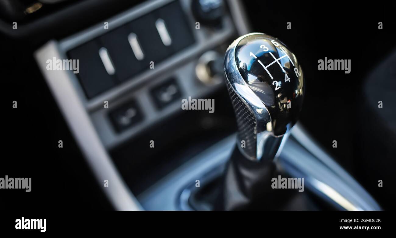 Gear lever. Manual Transmission. Hand on the gear shift in a car Stock ...