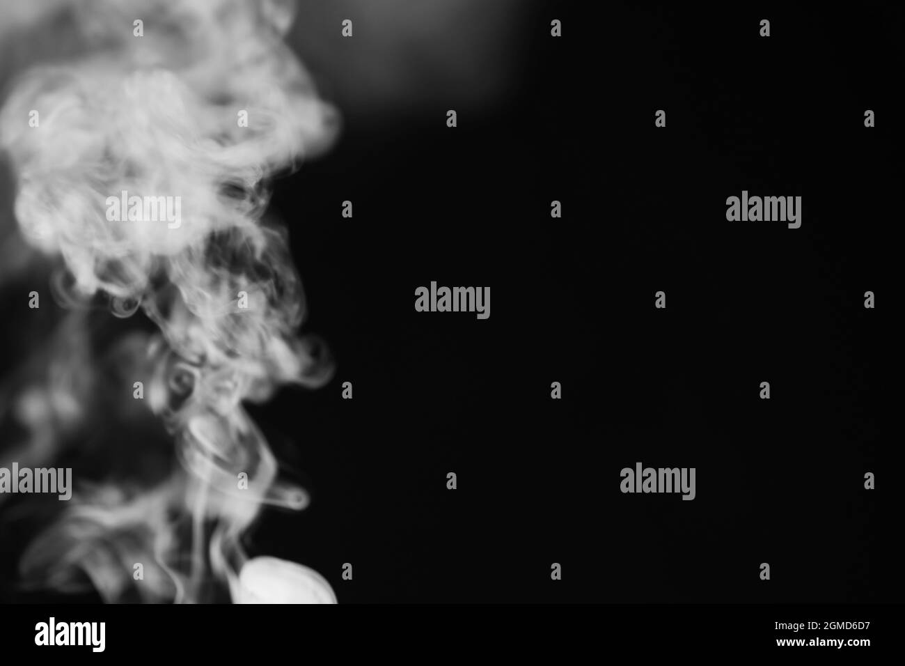 White smoke on a black background. Texture of smoke. Clubs of white ...