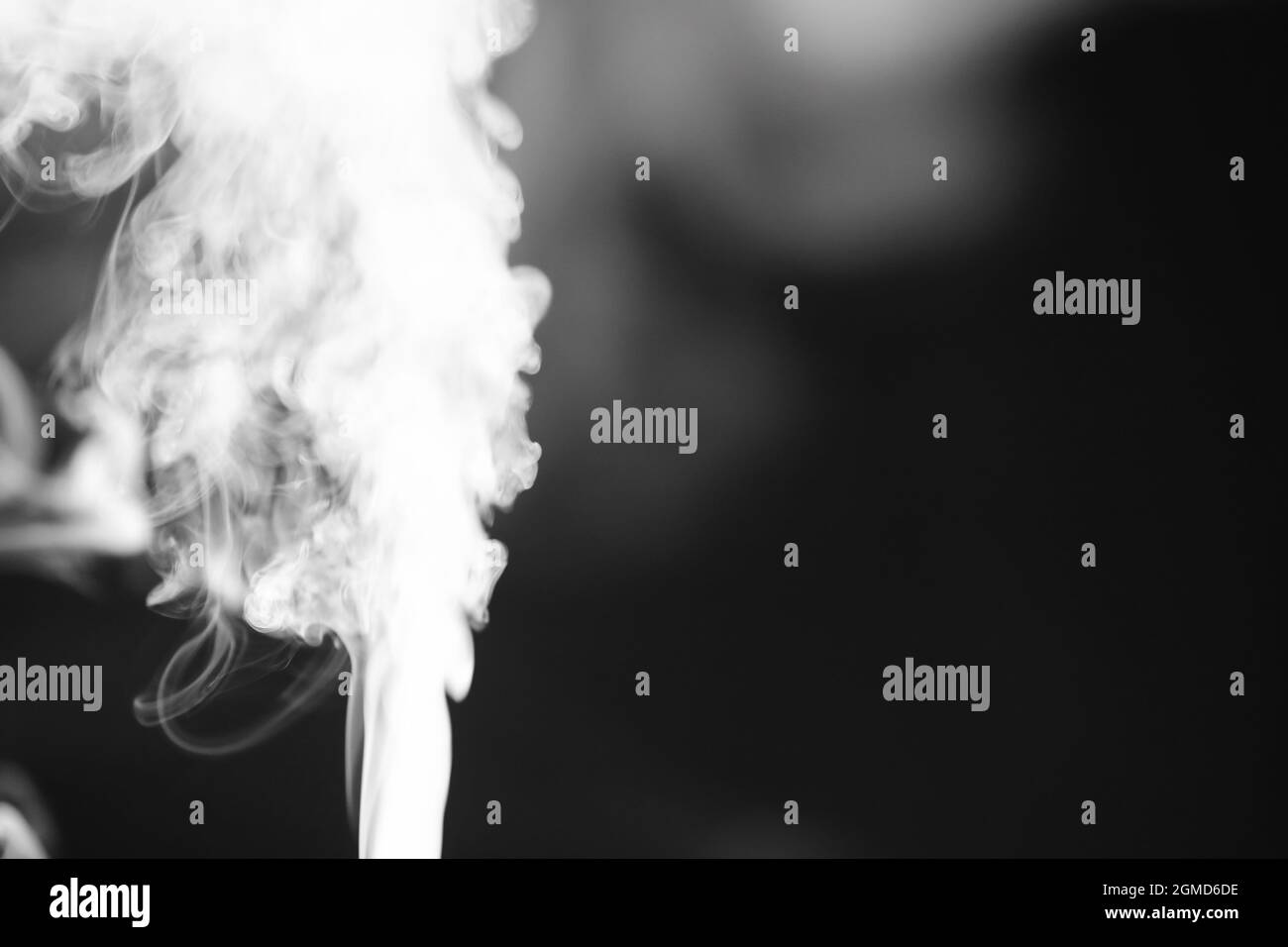 White smoke on a black background. Texture of smoke. Clubs of white ...