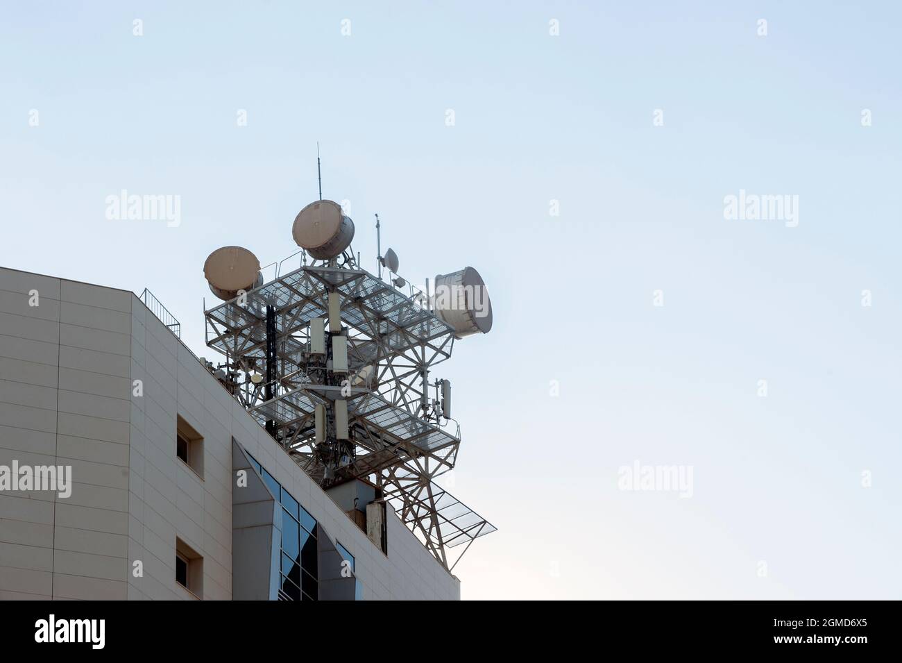 Communication antennas on the top of the building Stock Photo - Alamy