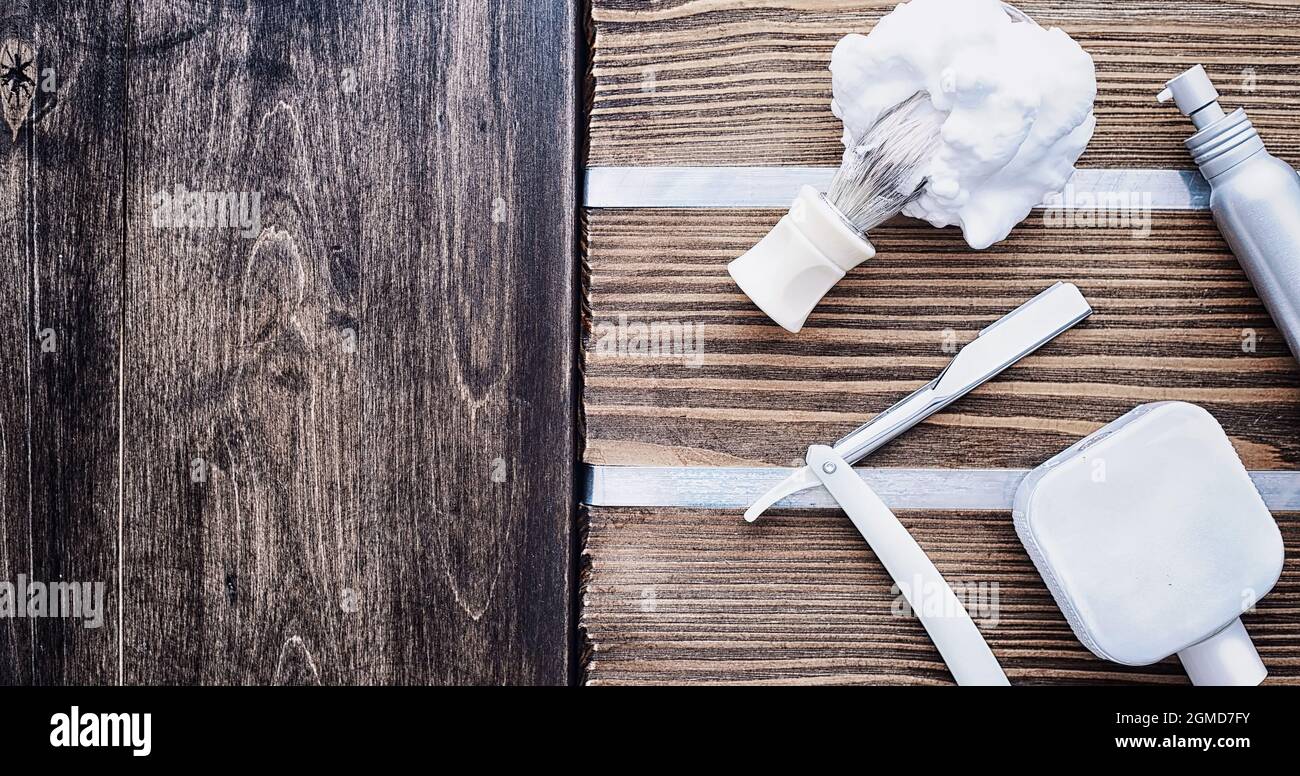 Shaving accessories on a wooden texture background. Tools. Disposable ...