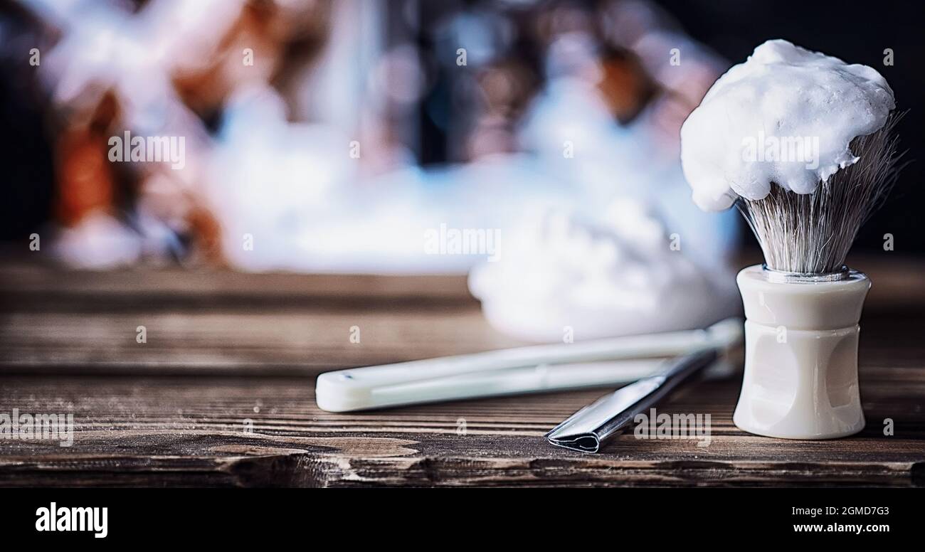 Shaving accessories on a wooden texture background. Tools. Disposable ...