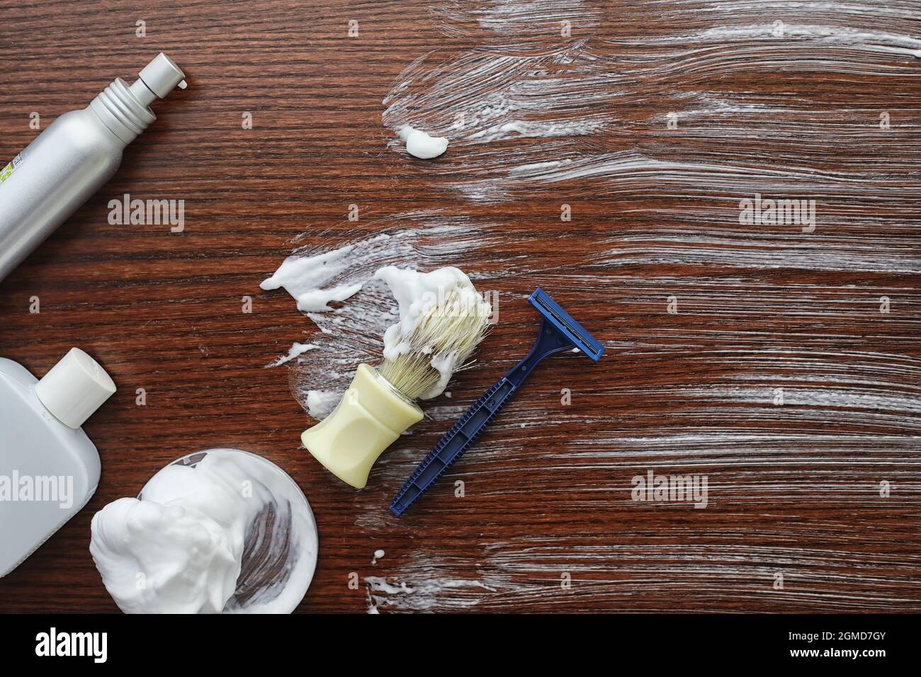 Shaving accessories on a wooden texture background. Tools. Disposable ...