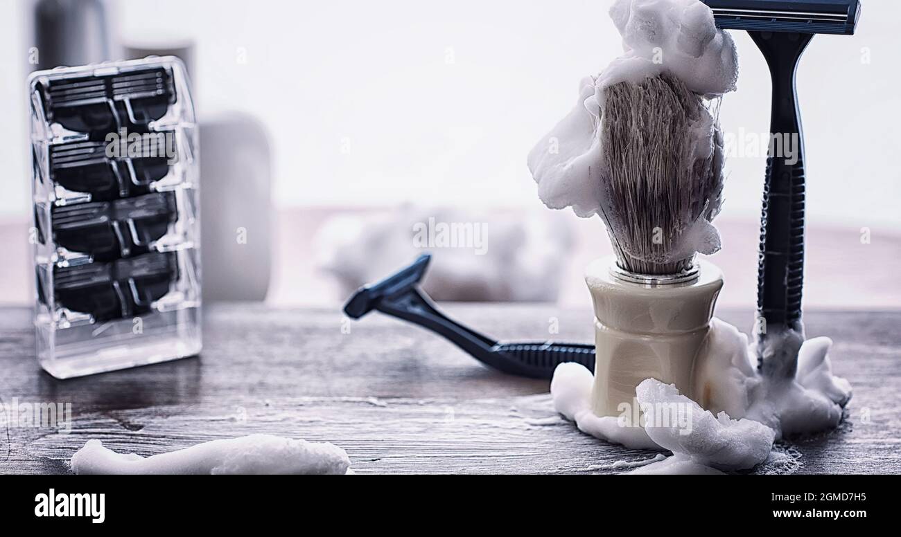 Shaving accessories on a wooden texture background. Tools. Disposable ...