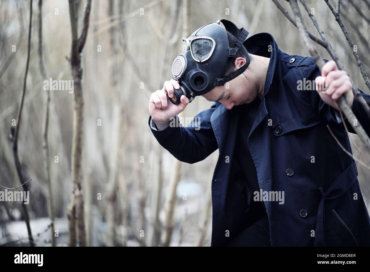 The guy in the coat and gas mask. Post-apocalyptic portrait Asian ...