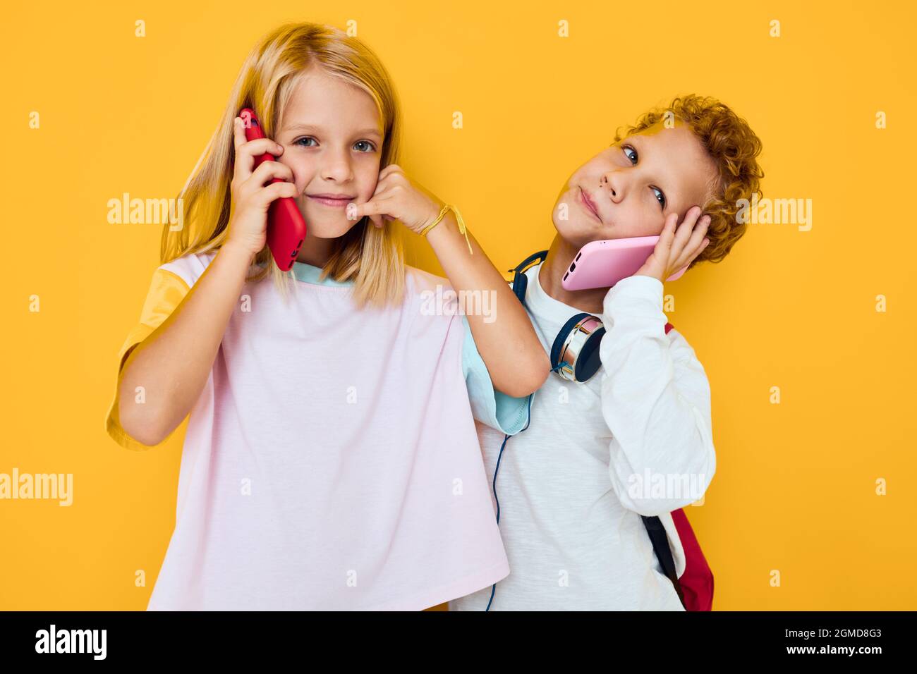 school children looking into a smartphone and playing games Studio ...