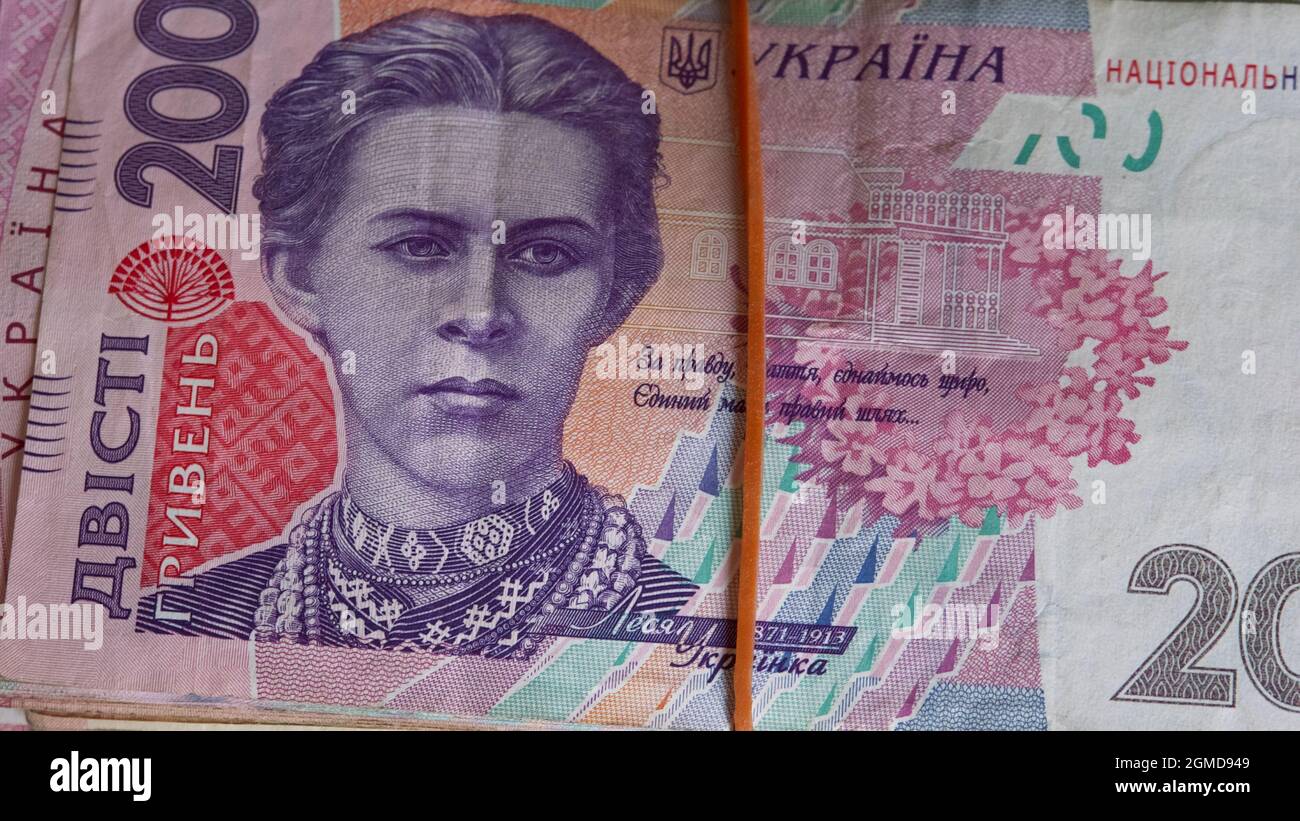 A bundle of Ukrainian money tied with an elastic band. Ukrainian ...