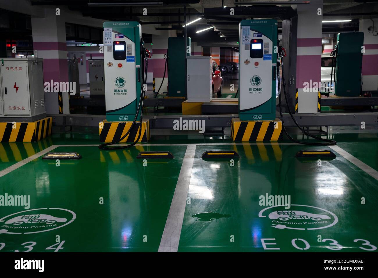 electric vehicle charging station in a underground parking lot Stock ...