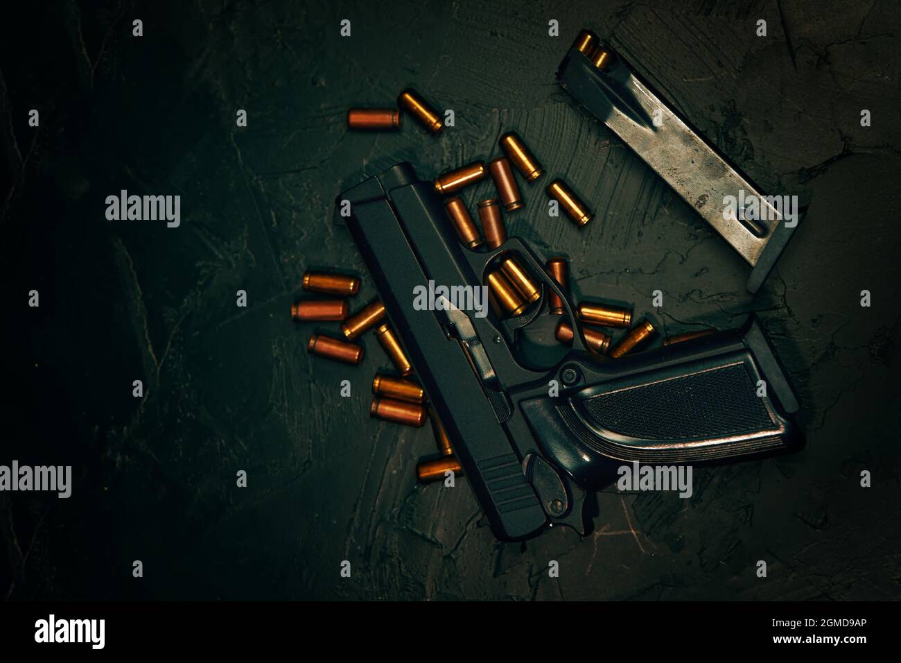 Top view of gun and bullets. Flat lay of pistol and ammunition ...