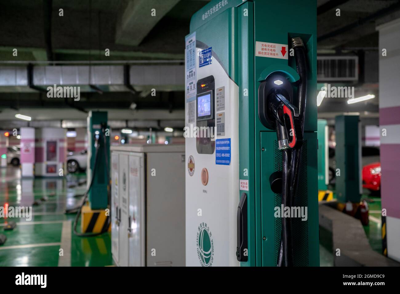 electric vehicle charging station in a underground parking lot Stock ...