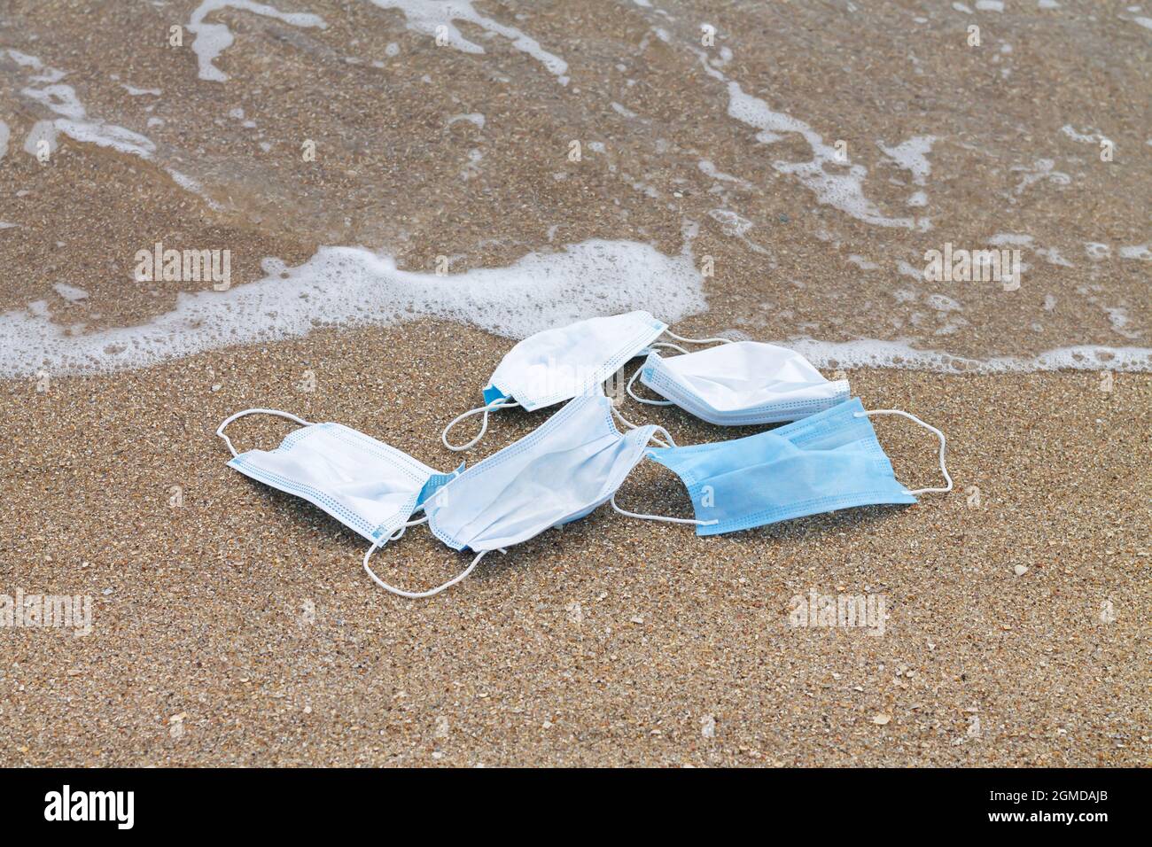 Used disposable protective face masks discarded to ocean. Environmental ...