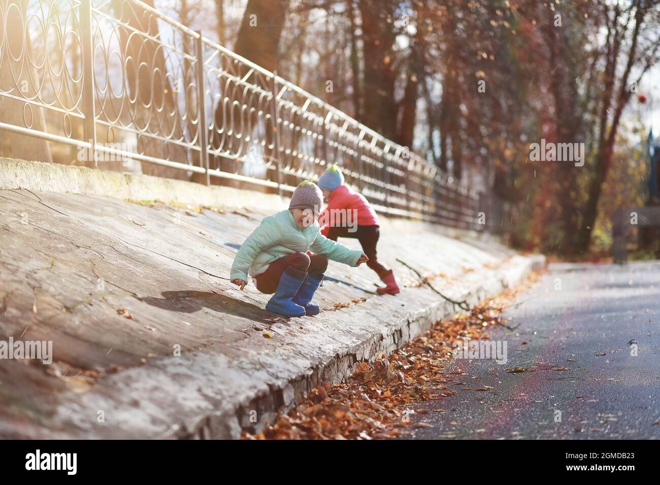 Children walk in the autumn park in the fall Stock Photo - Alamy