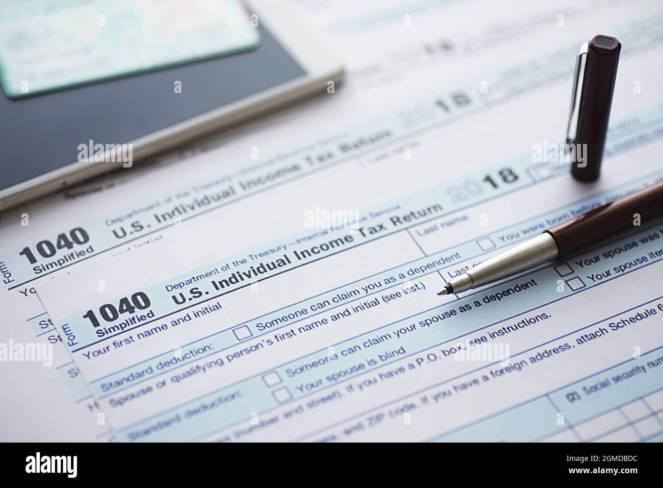 Annual tax reporting. Tax form on the table. Financial statements ...