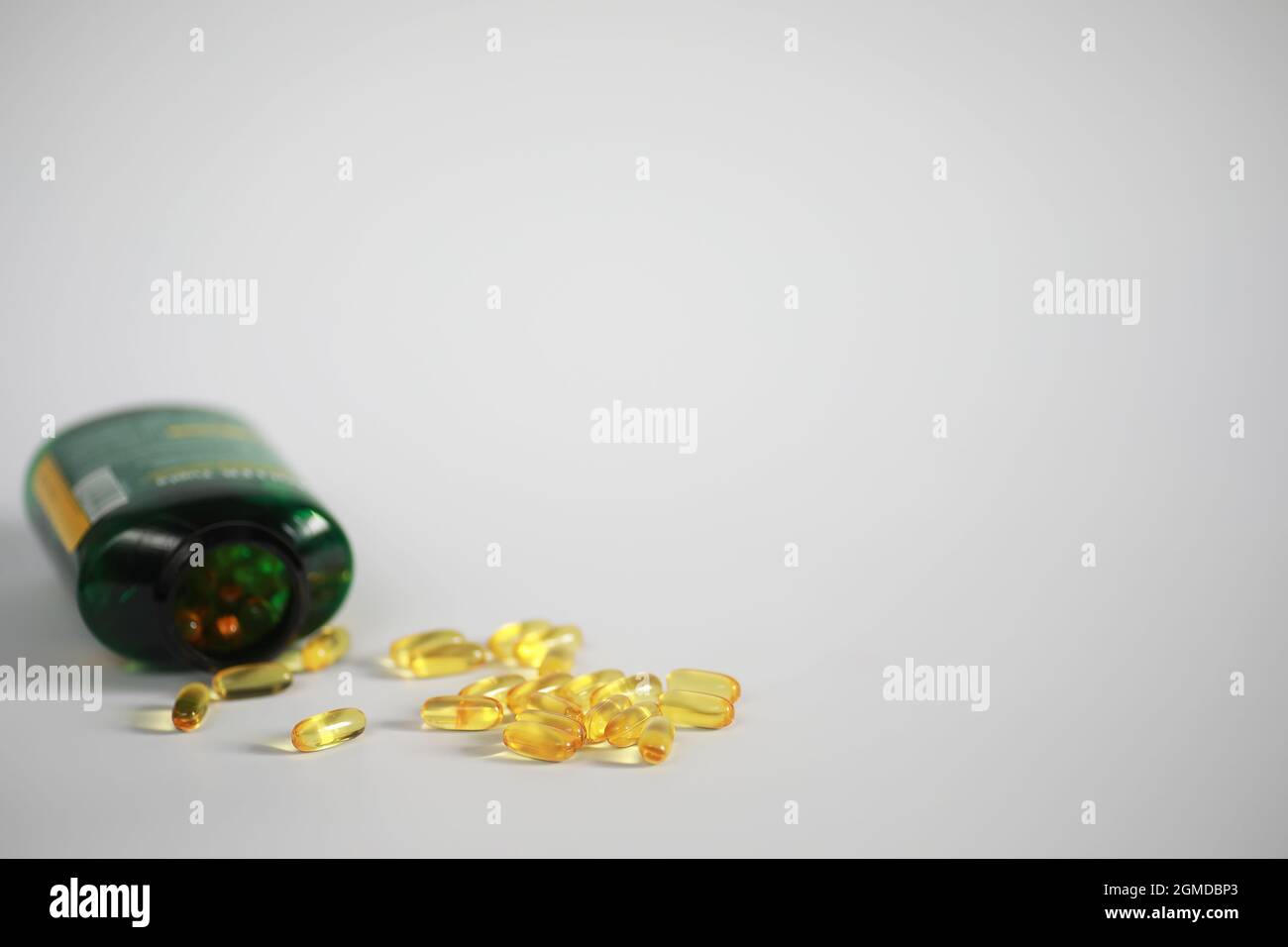 Medical medicines and supplements transparent capsules of yellow color ...