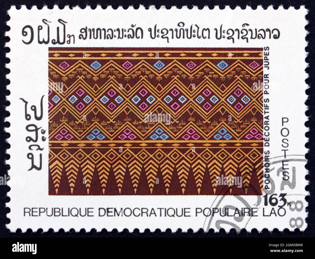 LAOS - CIRCA 1988: a stamp printed in Laos shows Skirt, Decorative ...