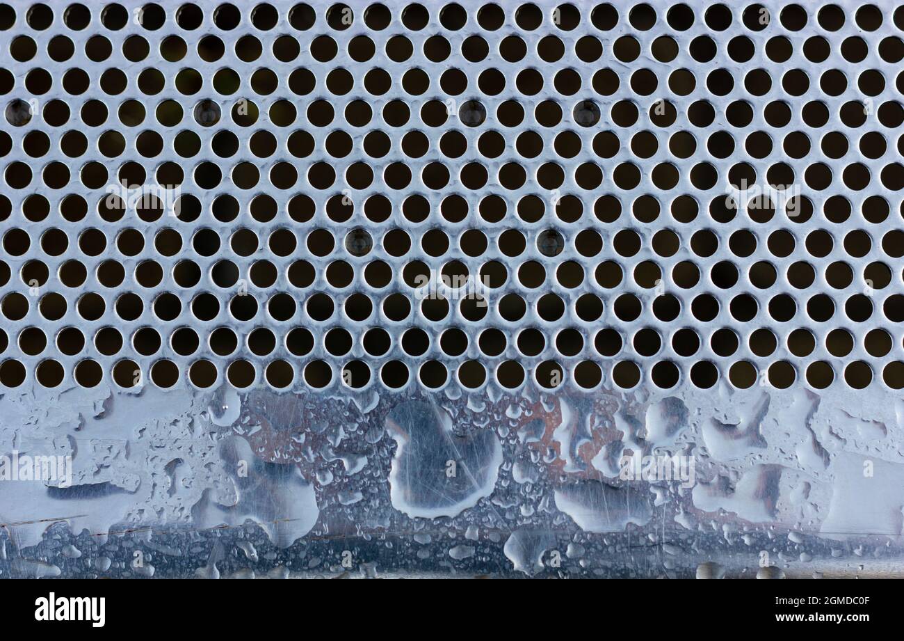 Wet metal surface. Perforated metal. Chrome plated surface Stock Photo ...