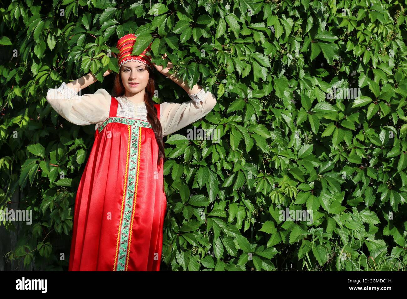 Slav in traditional dress ivy wall tree Stock Photo - Alamy