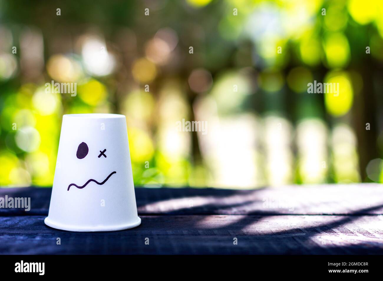 White cup with drawn emotion of surprise, confusion Stock Photo - Alamy