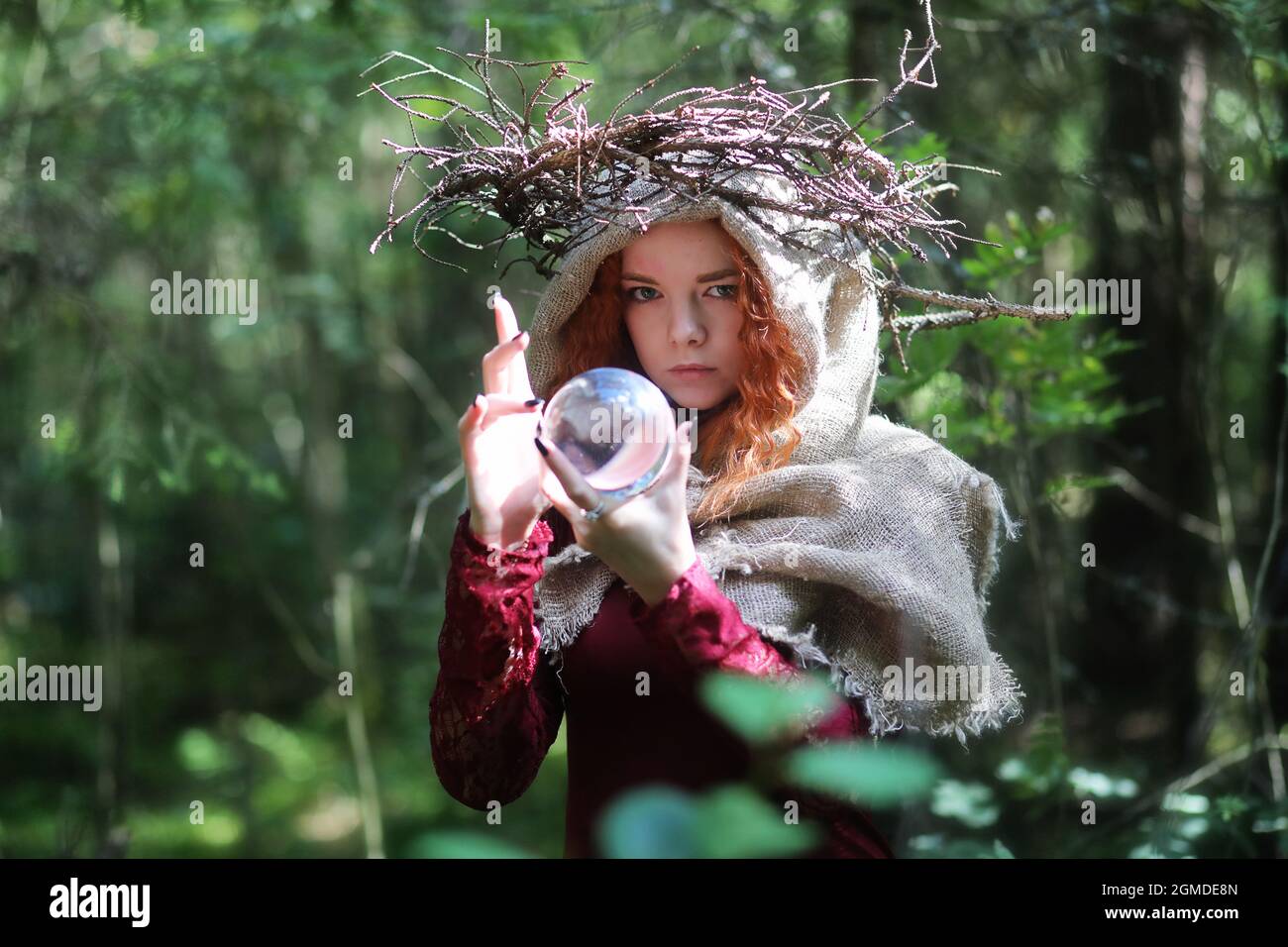 Fortune-teller conducts a ritual in the depths of the forest Stock ...