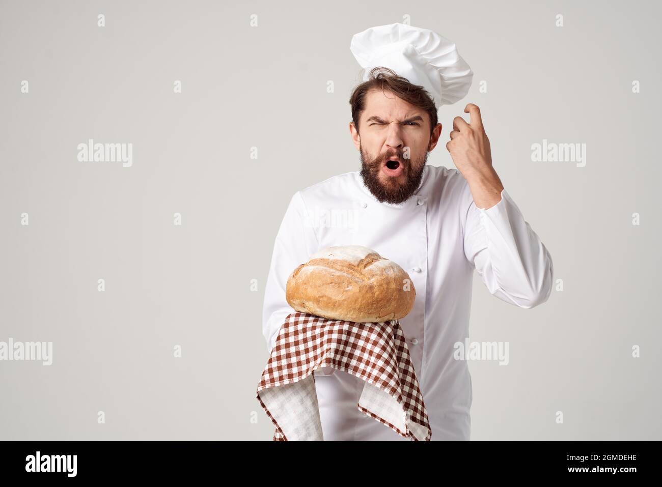 Baker Cooking bakery Professional emotions Stock Photo - Alamy