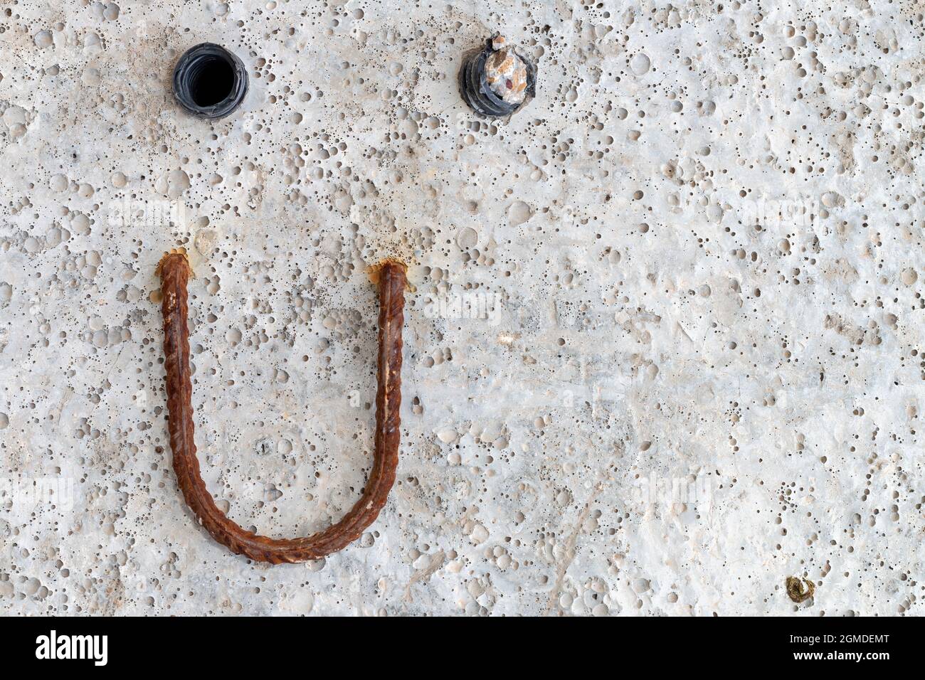Cinder block that looks like a smiling face Stock Photo - Alamy