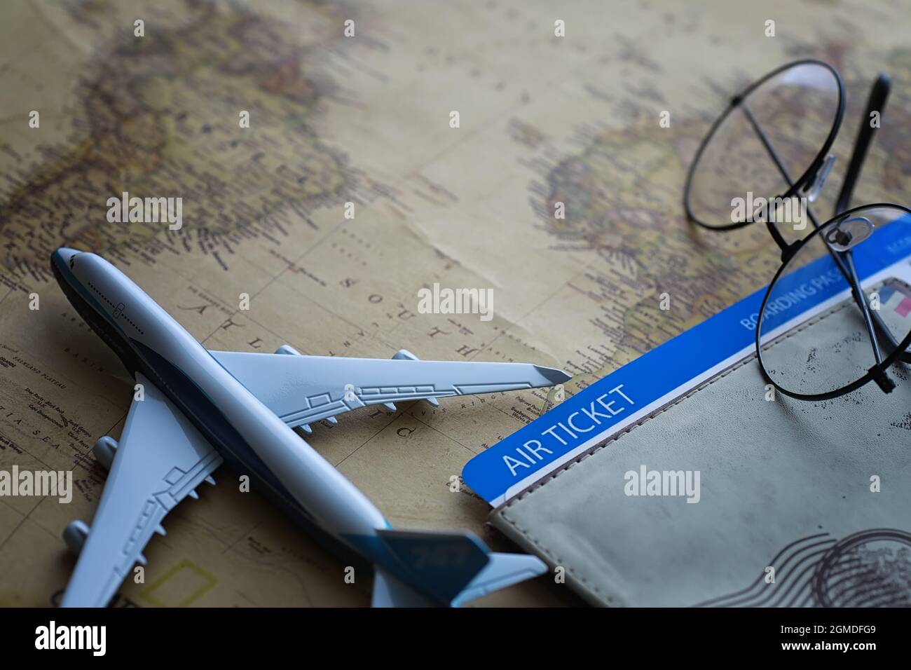 Travel concept. Map on the table and model aircraft Stock Photo - Alamy