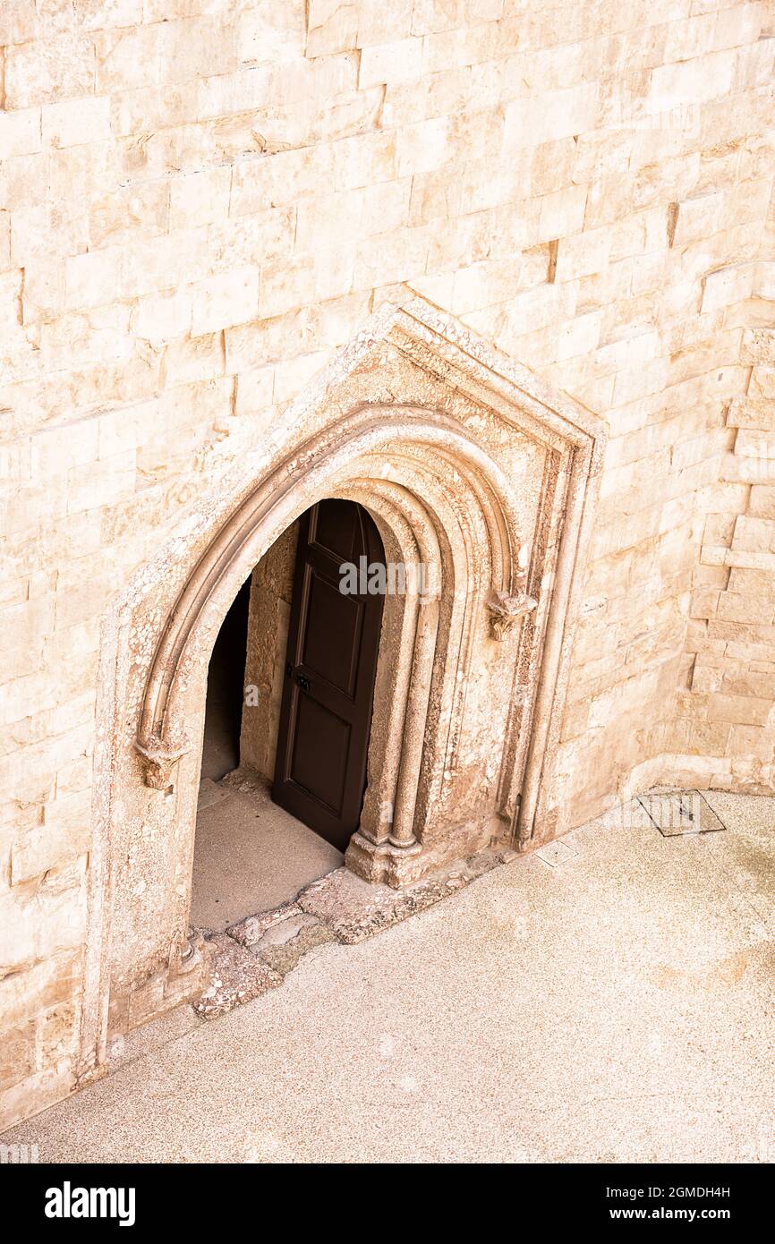 Andria, Italy - 18 June 2021: Internal door with arches, columns and ...