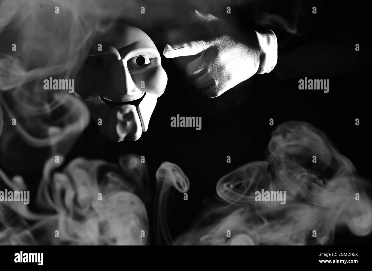 White scary mask on a black background with whites hands Stock Photo ...