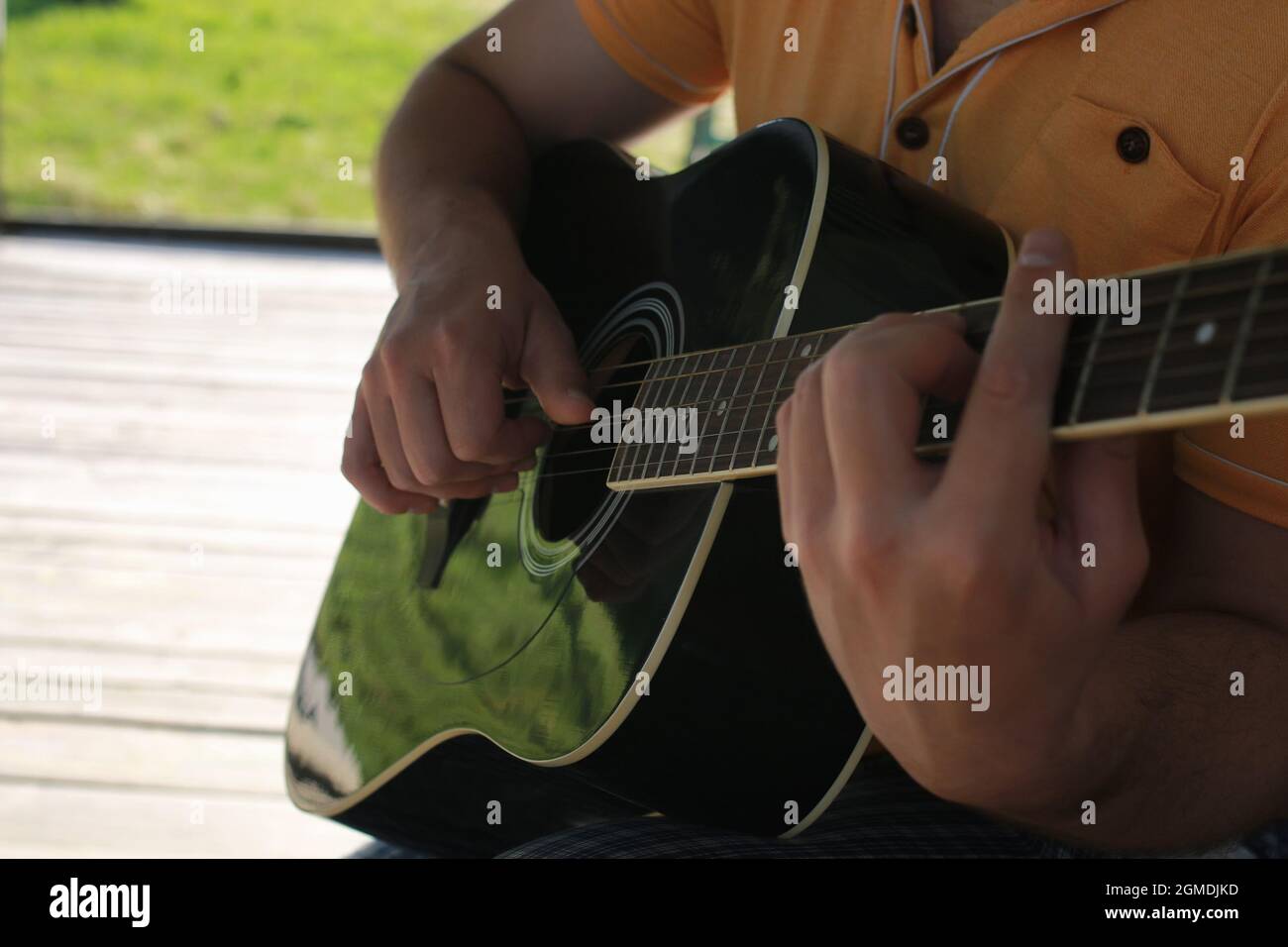 guitar string man hand outdoor Stock Photo - Alamy