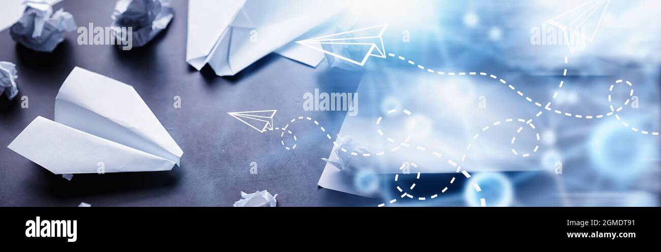 Paper airplane on the table. Origami model on a dark background ...